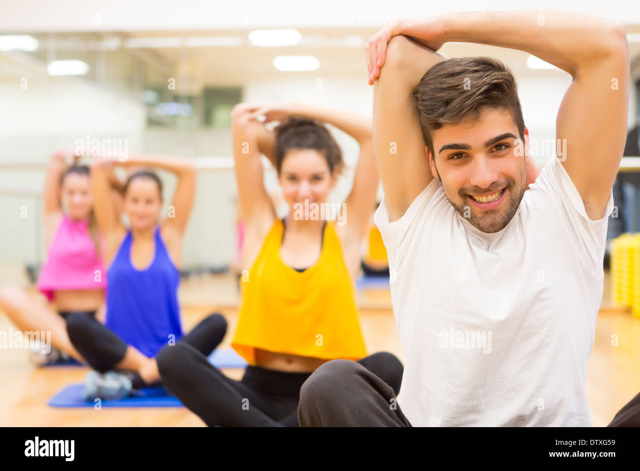 Group of friends working out at the gym Stock Photo - Alamy