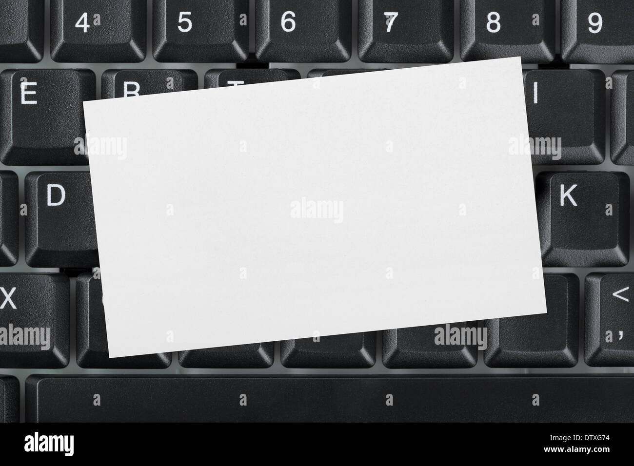 Computer keyboard and paper card Stock Photo - Alamy