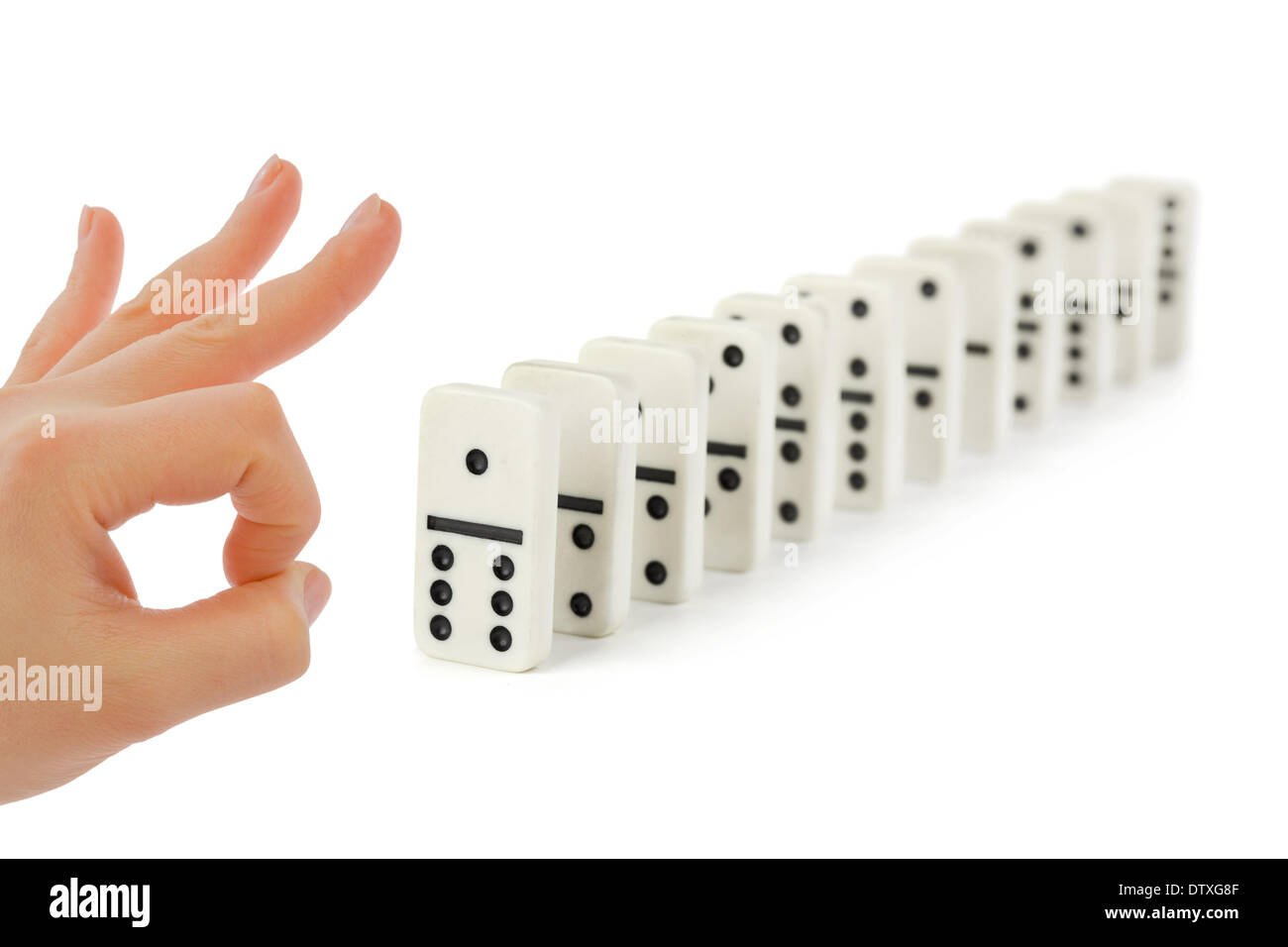 Hand and domino Stock Photo - Alamy
