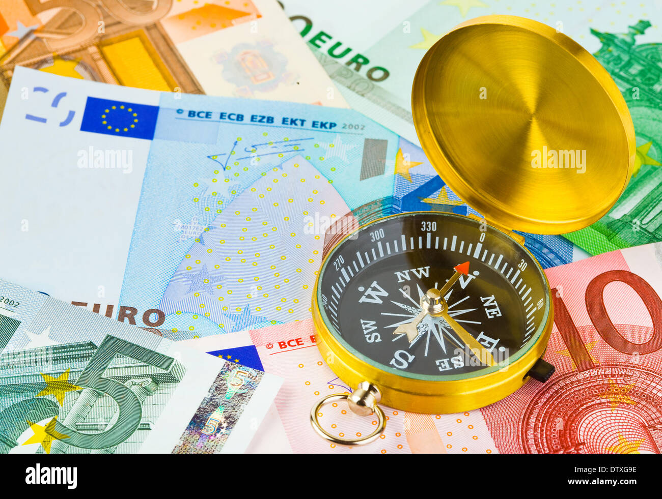 Compass and money Stock Photo - Alamy