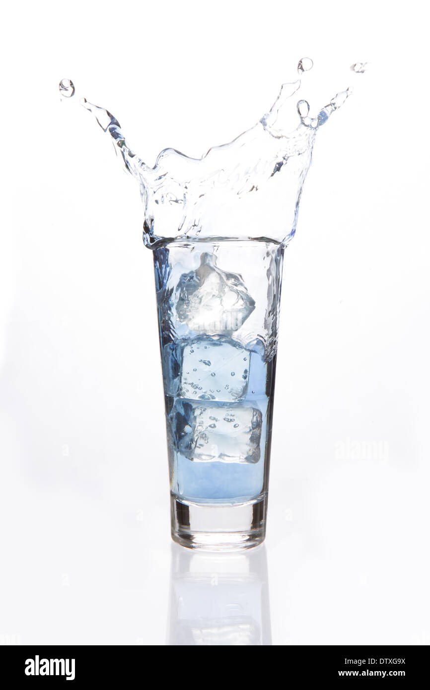 Big ice cubes falling in a filled glass Stock Photo - Alamy