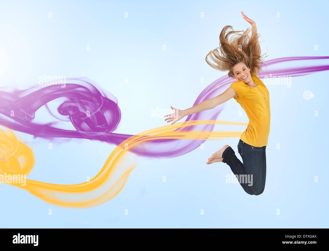 Pretty girl jumping for joy Stock Photo - Alamy