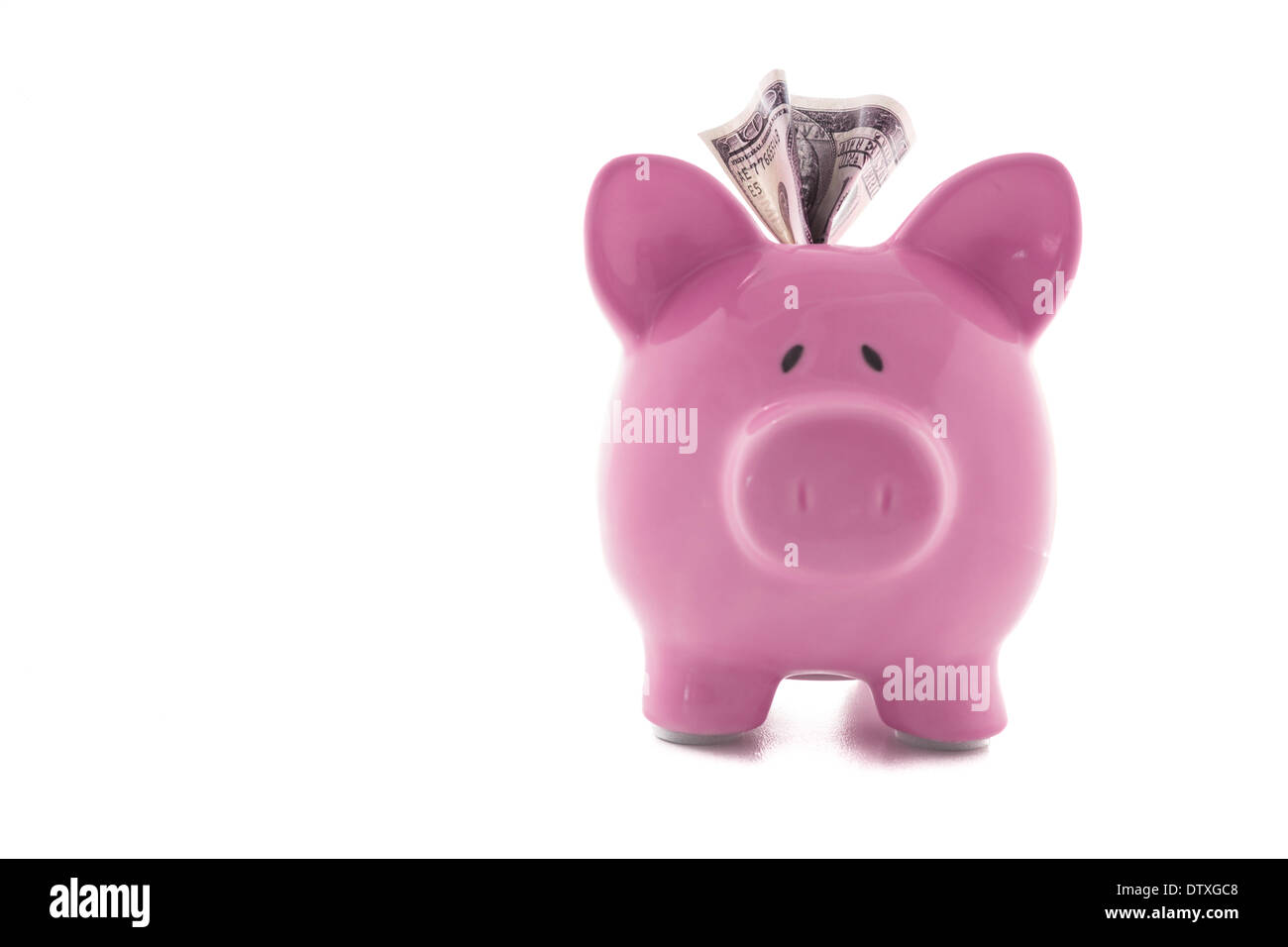 Dollar note stuck in piggy bank Stock Photo - Alamy