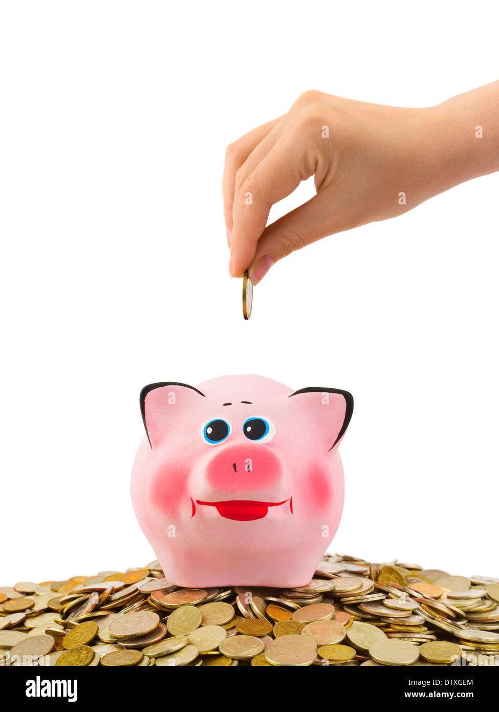 Piggy bank and hand with coin Stock Photo - Alamy