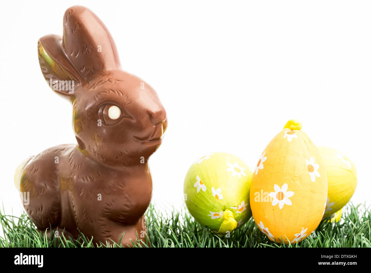 Chocolate bunny rabbit and three easter eggs Stock Photo - Alamy