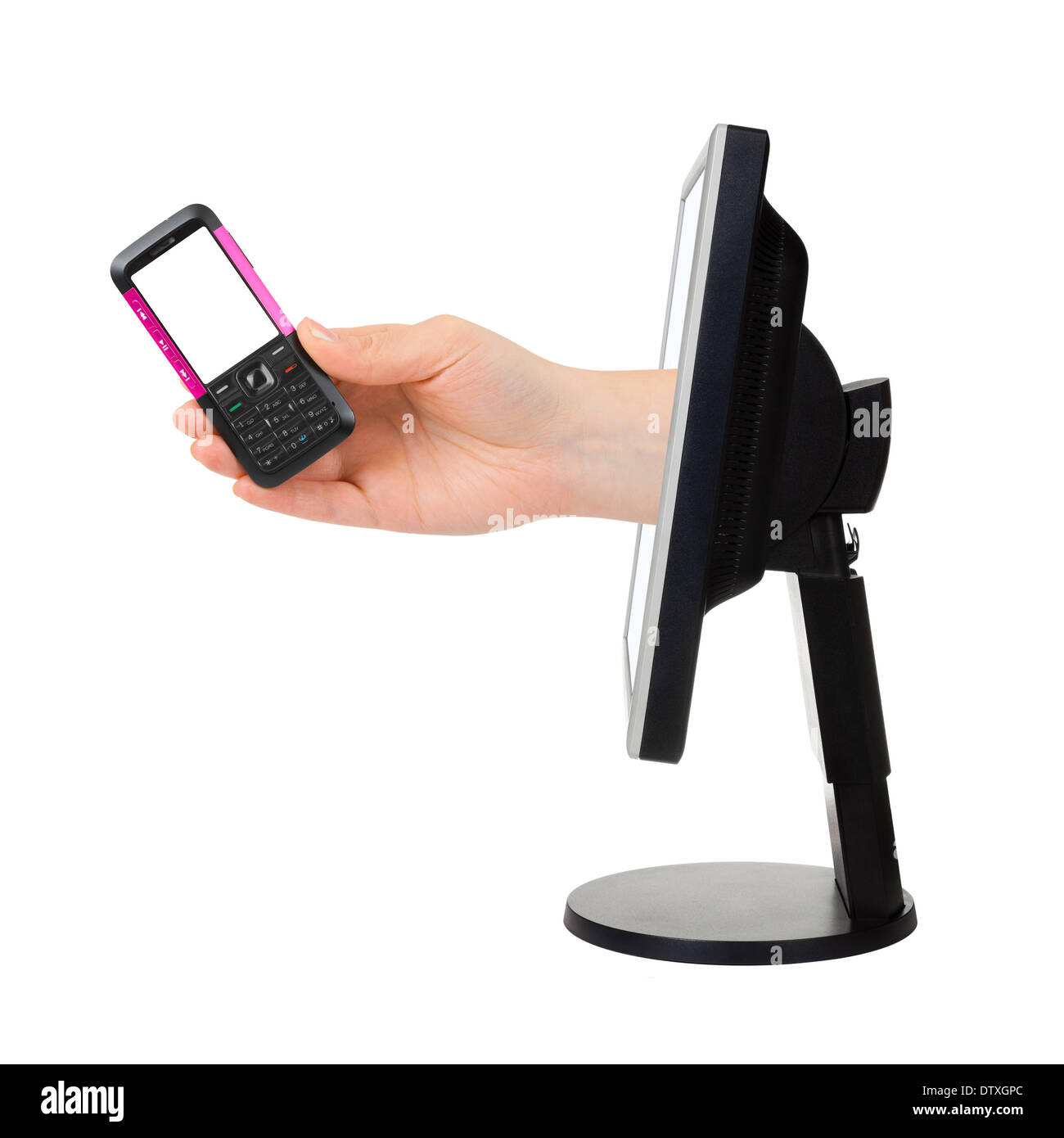 Computer screen and hand with phone Stock Photo - Alamy