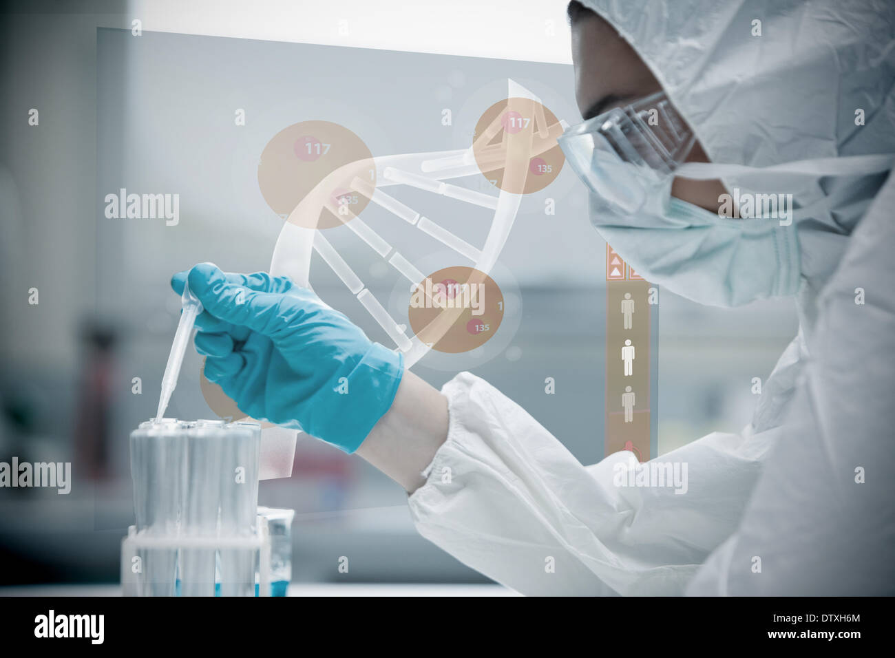 Chemist pouring liquid into test tubes Stock Photo - Alamy