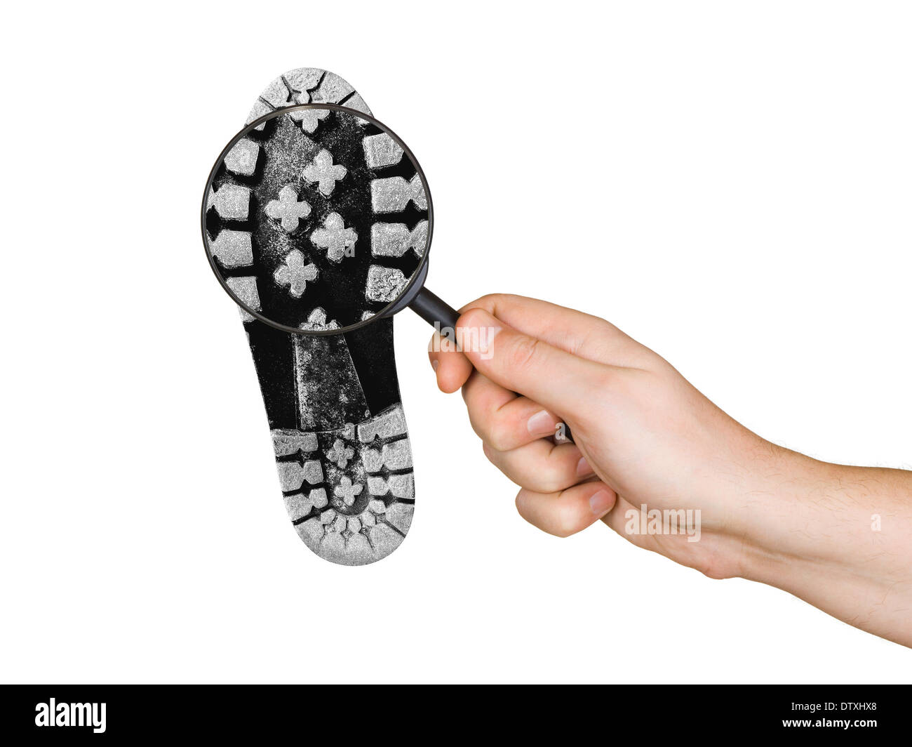 Magnifying glass in hand and shoe printout Stock Photo - Alamy