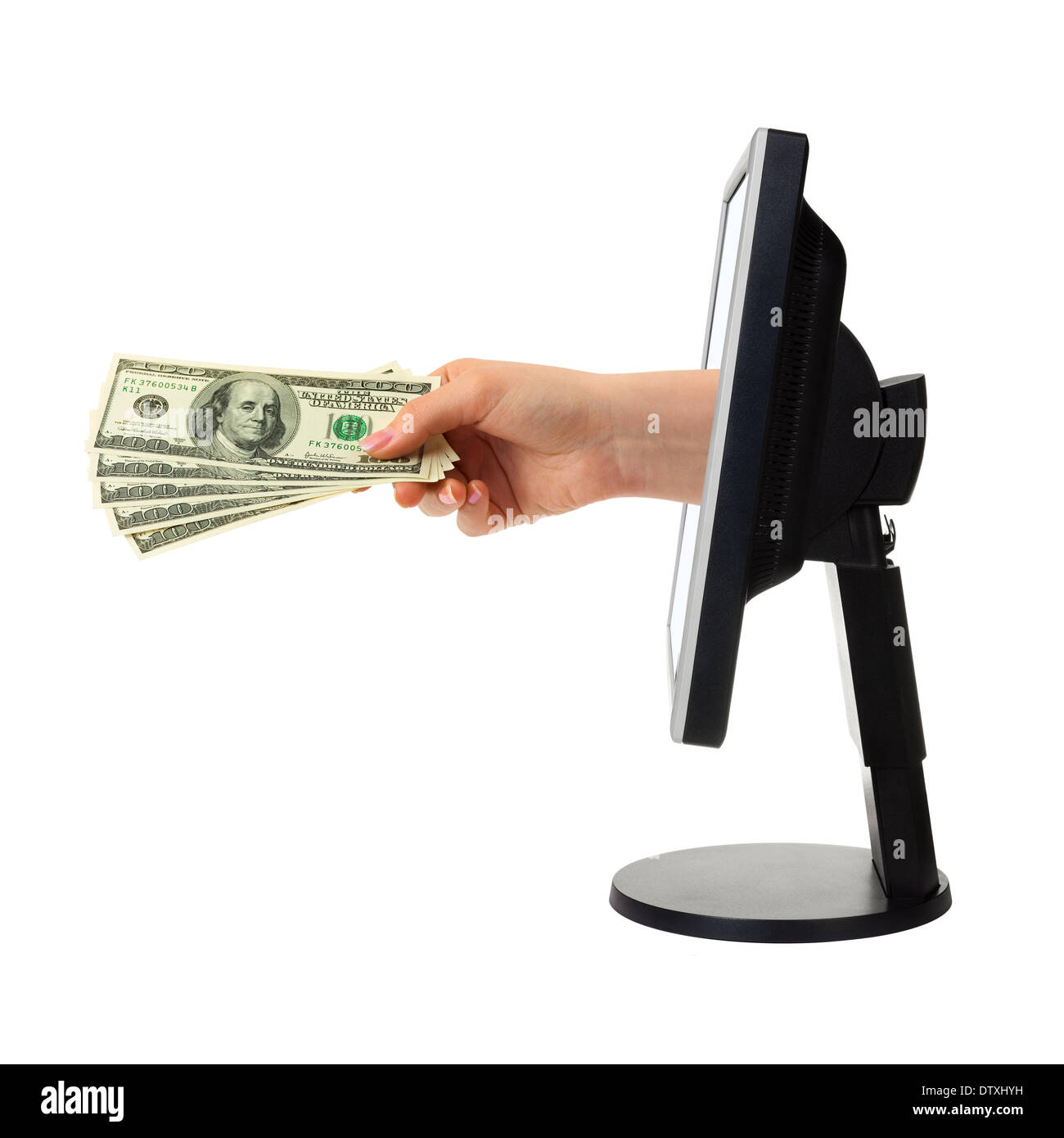 Hand with money and computer monitor Stock Photo - Alamy