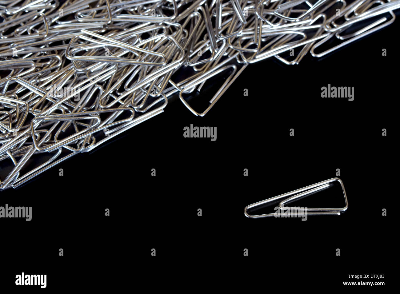 Clips on black paper Stock Photo - Alamy