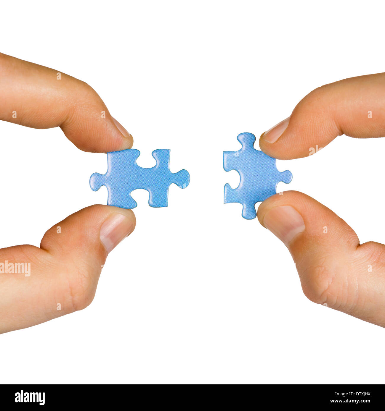 Hands and puzzle Stock Photo - Alamy