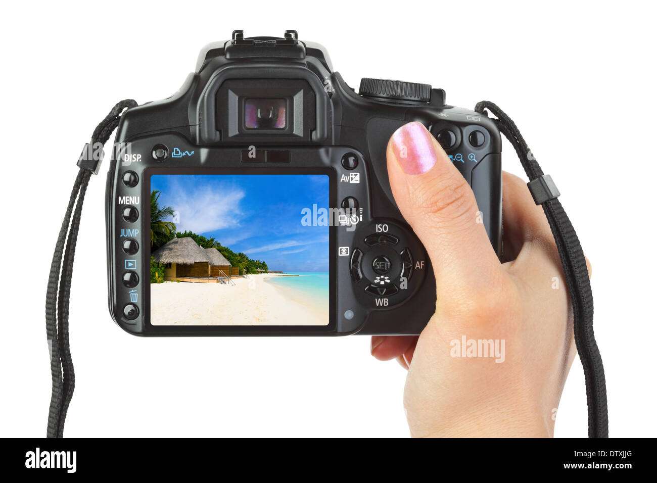 Camera in hand and beach landscape Stock Photo - Alamy