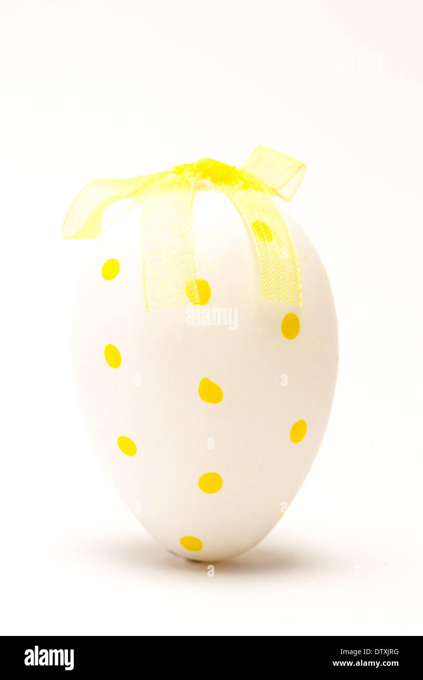 Yellow easter egg with ribbon Stock Photo - Alamy