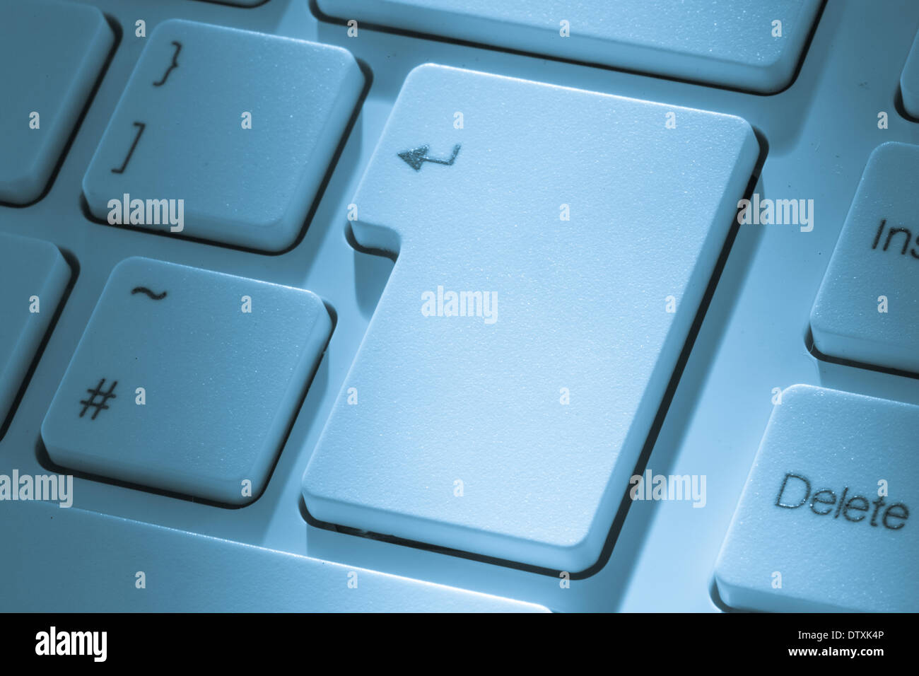 Enter key in blue Stock Photo - Alamy