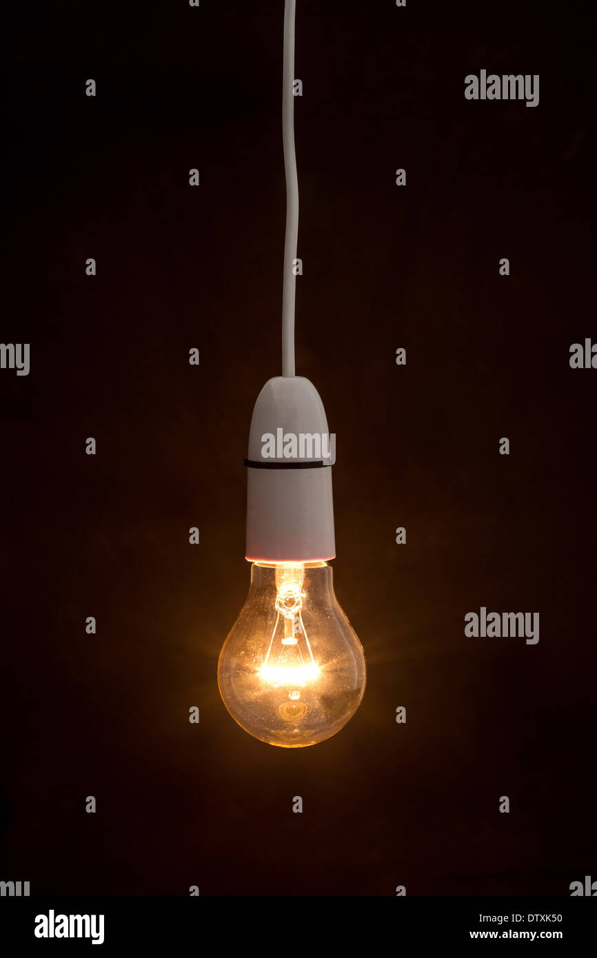 Bright light bulb turned on Stock Photo - Alamy