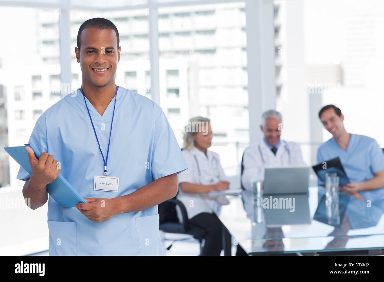 Portrait doctor holding file hi-res stock photography and images - Alamy
