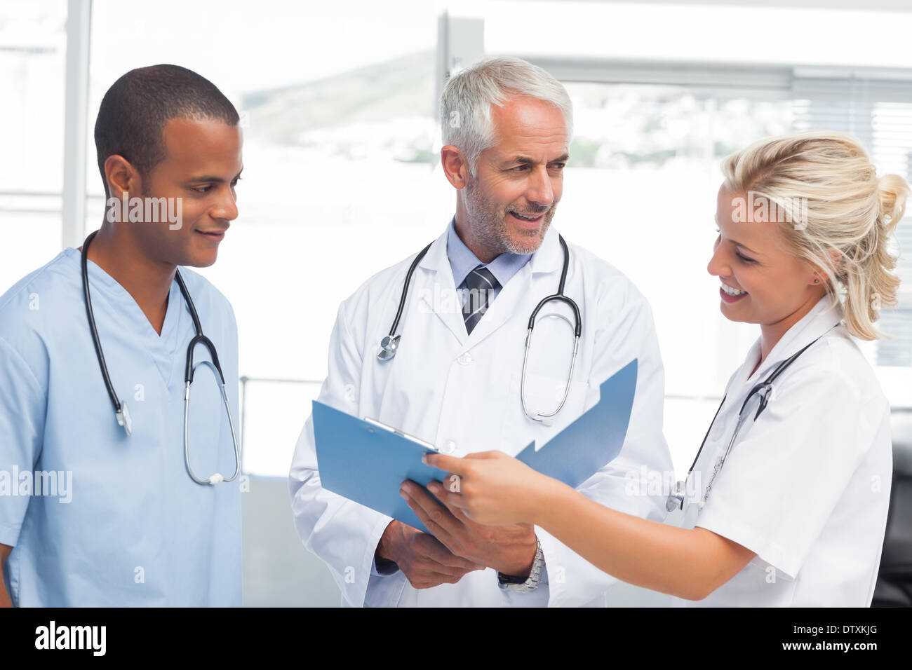 Medical team examining file hi-res stock photography and images - Alamy