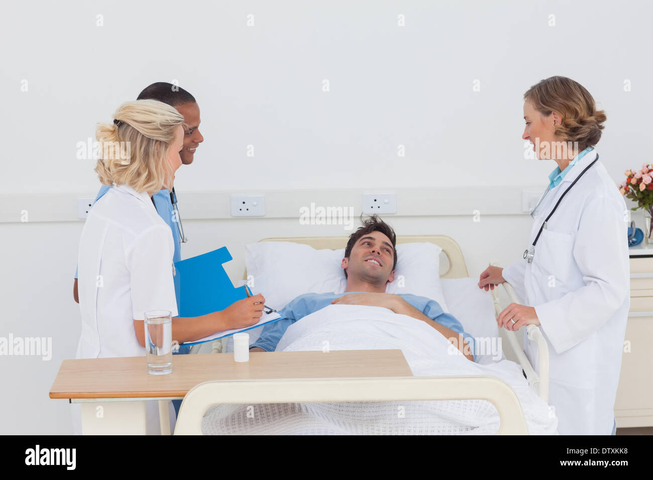Friendly nurse taking care hi-res stock photography and images - Alamy