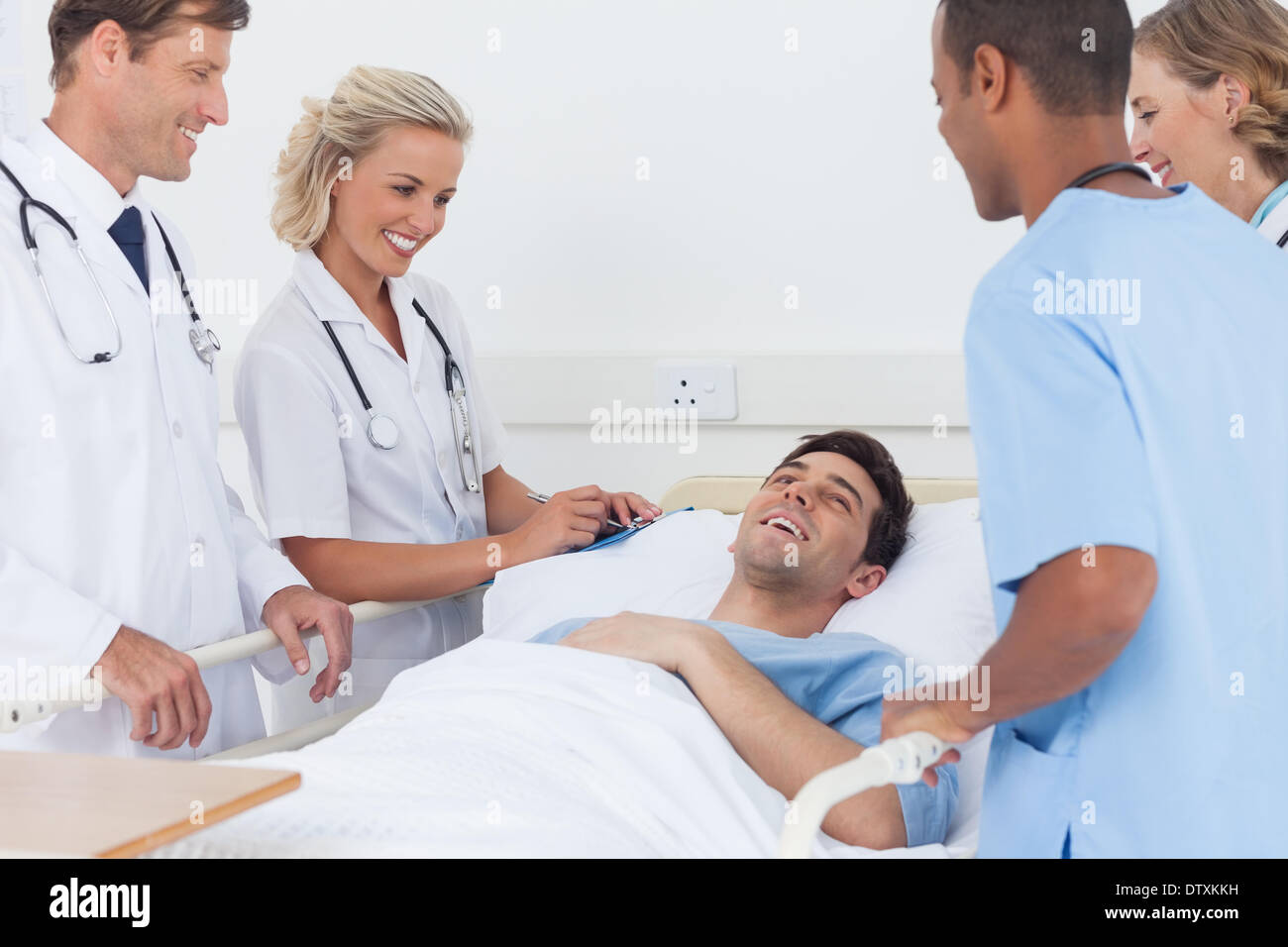 Medical team laughing Stock Photo - Alamy
