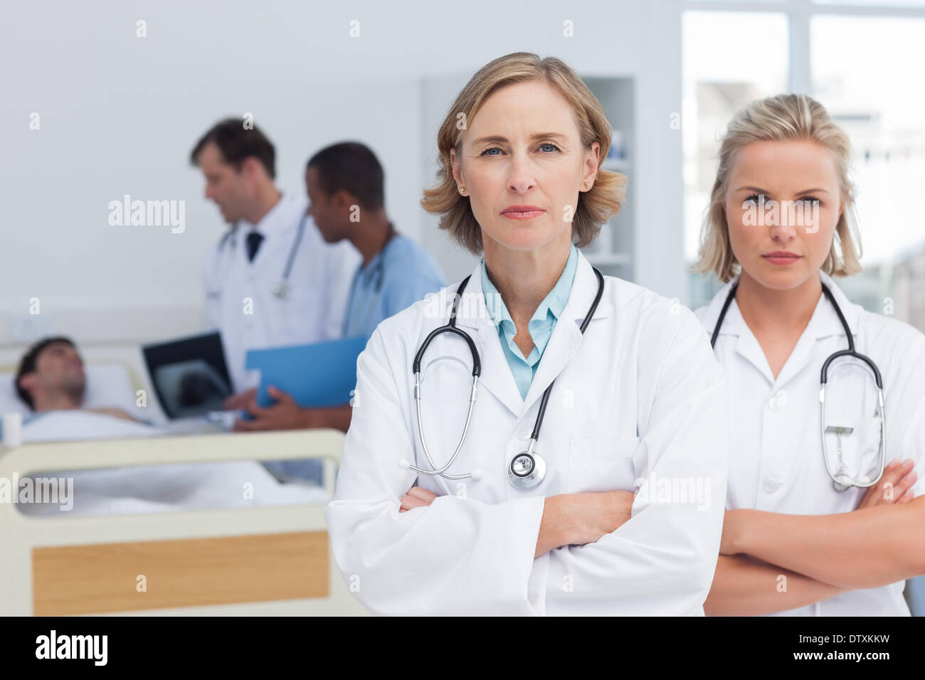 Man and two women serious hi-res stock photography and images - Alamy