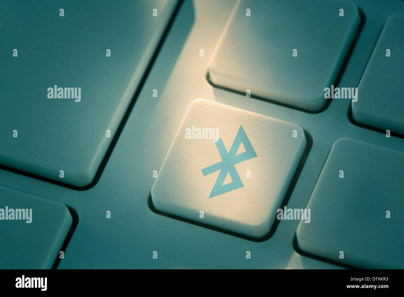 Blue bluetooth button on keyboard Stock Photo - Alamy