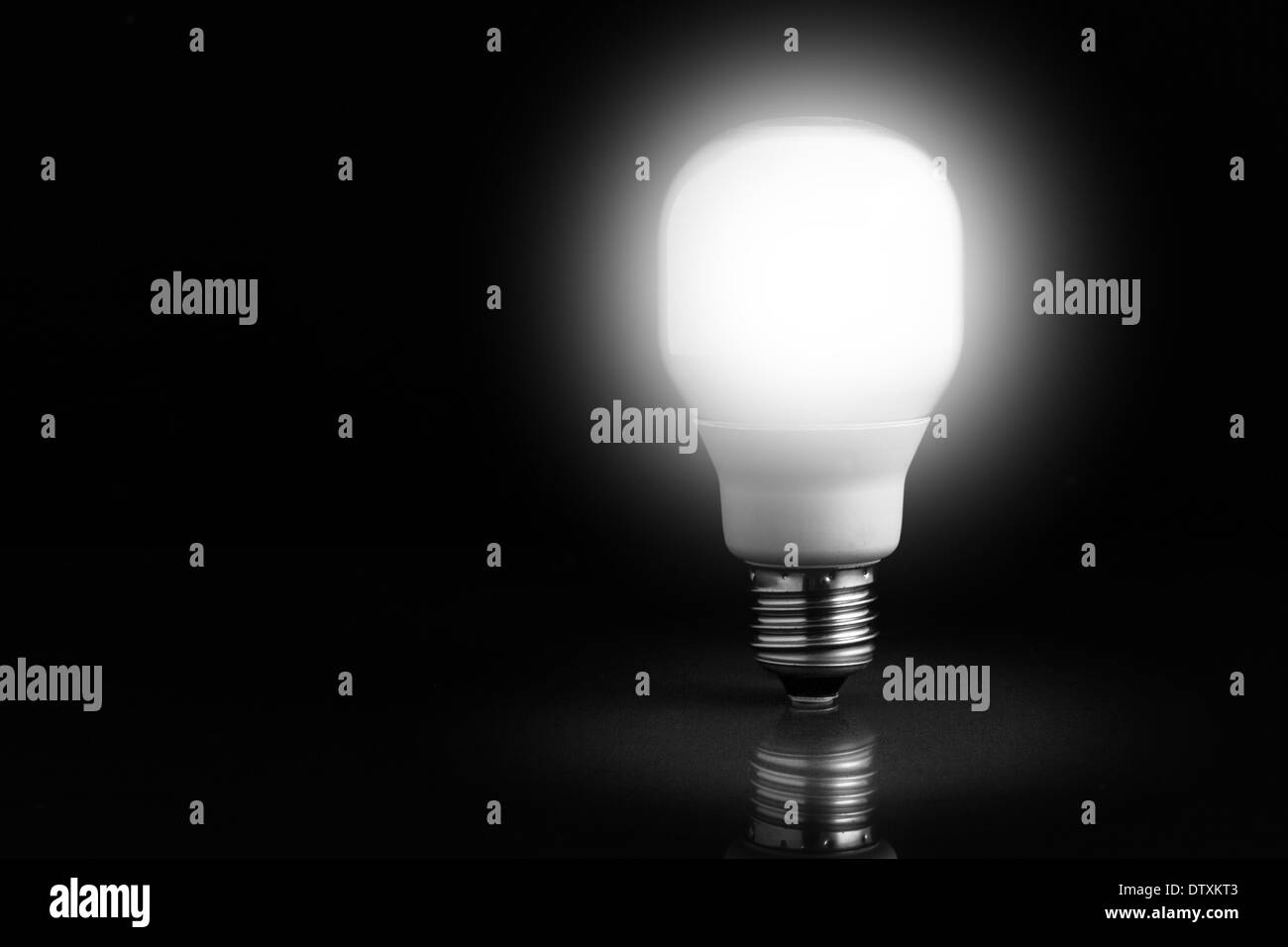 Light bulb standing and lighting Stock Photo - Alamy