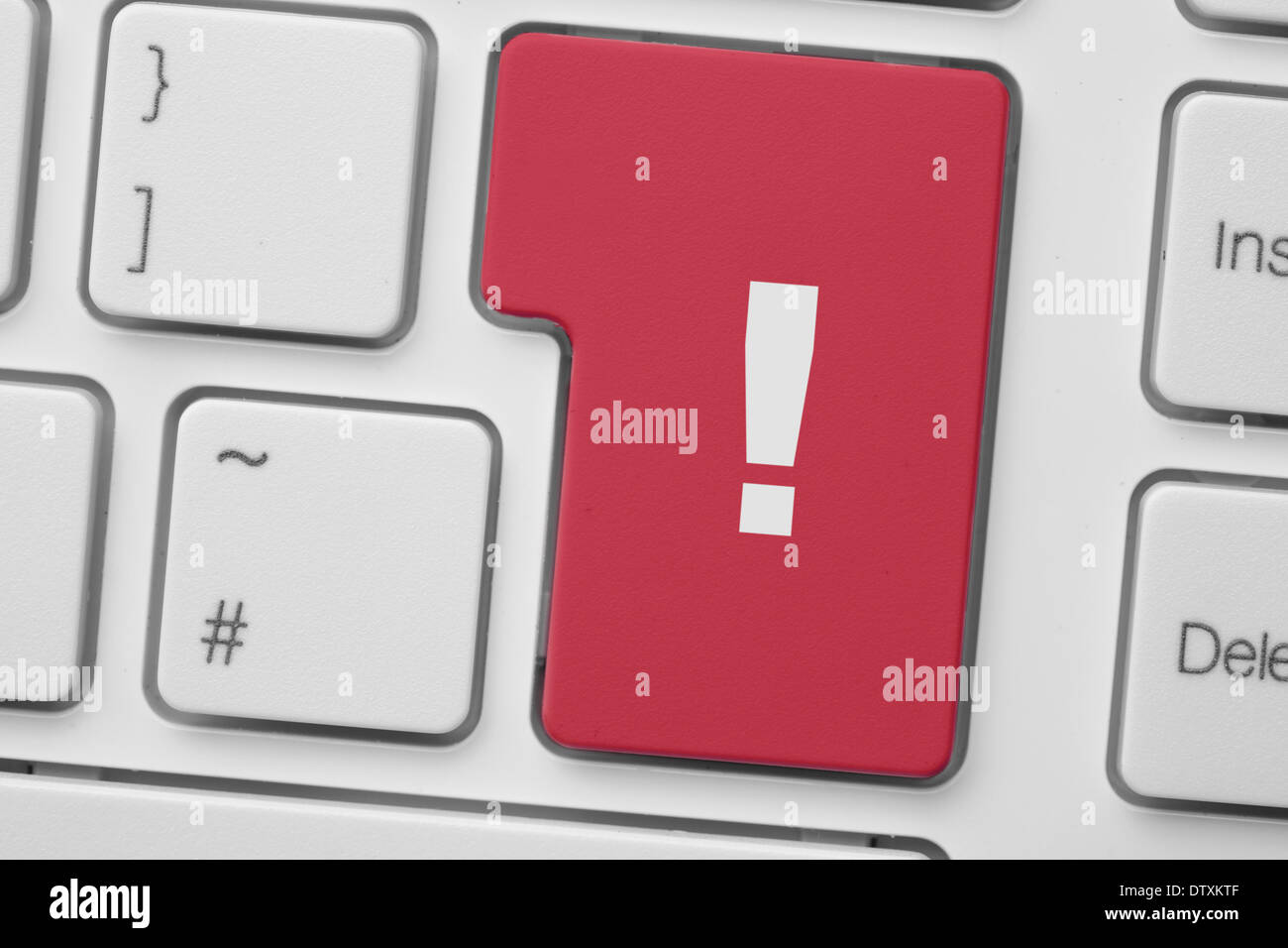 Red exclamation mark button on keyboard Stock Photo - Alamy