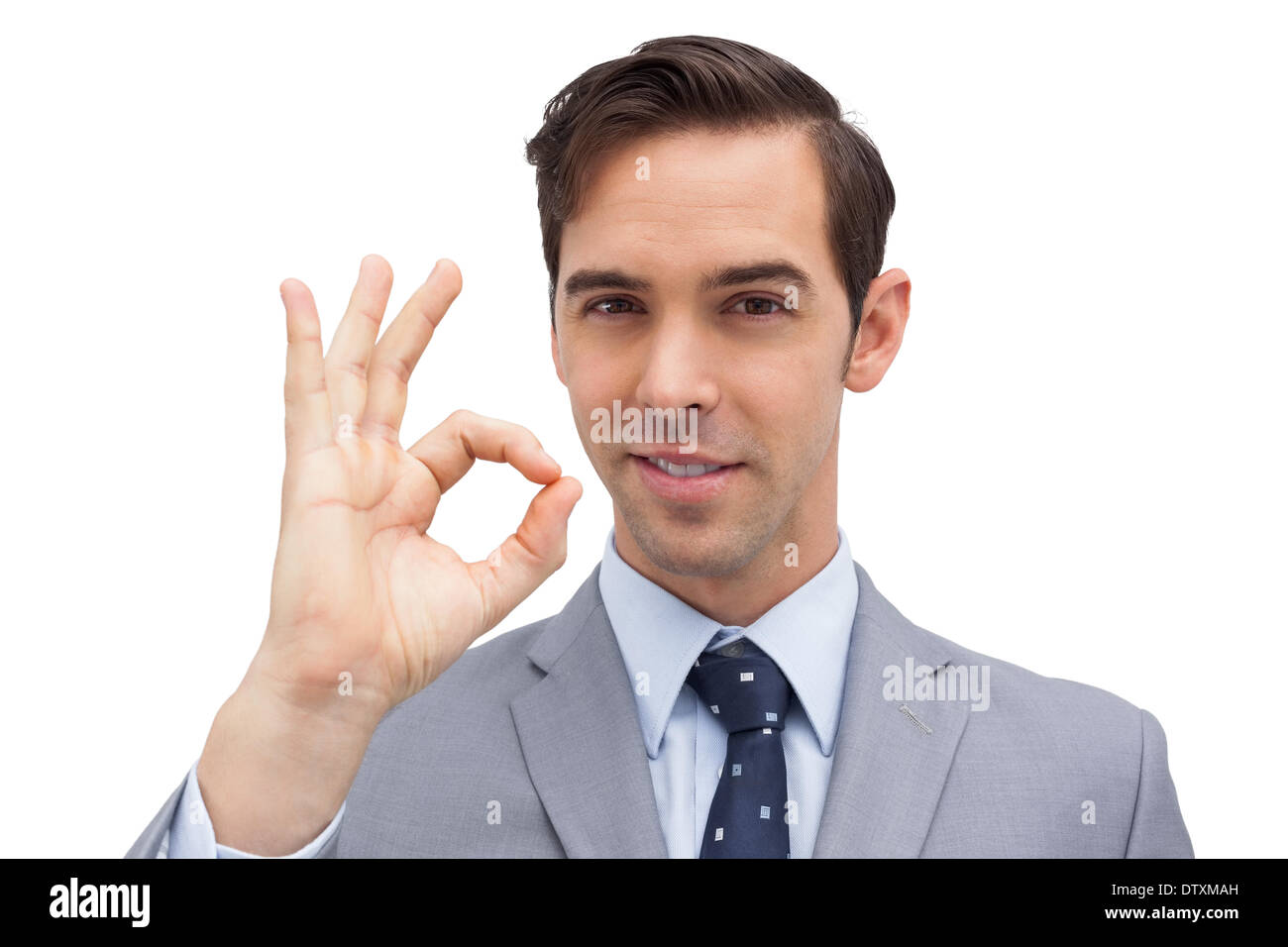 Businessman giving ok sign Stock Photo - Alamy