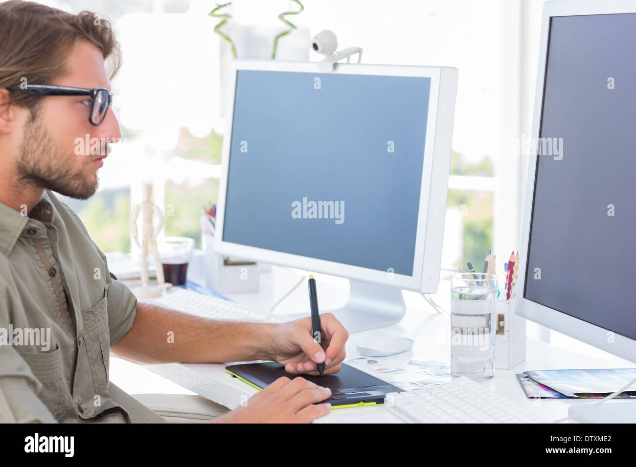 Graphic designer using graphics tablet Stock Photo - Alamy