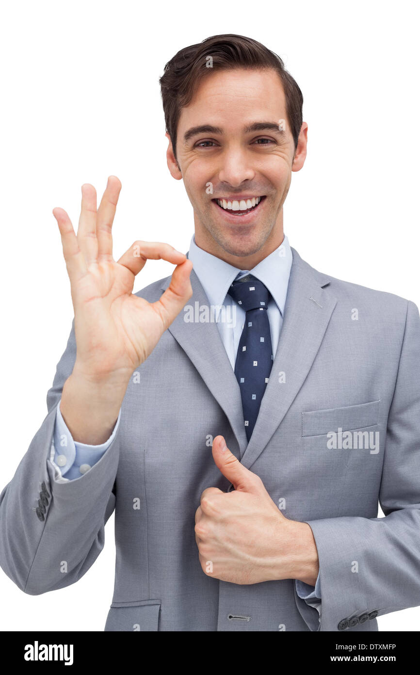 Cheerful businessman showing ok sign Stock Photo - Alamy