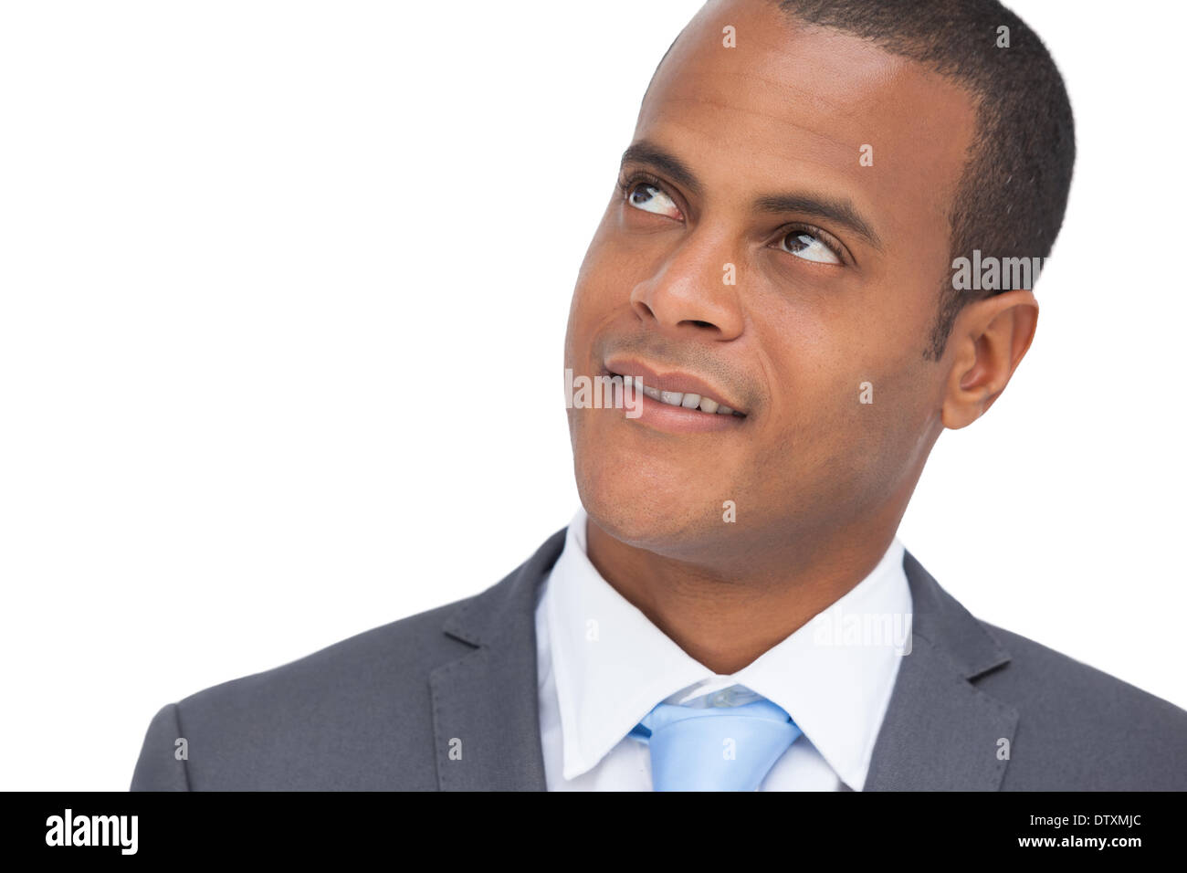Smiling serious businessman thinking Stock Photo - Alamy