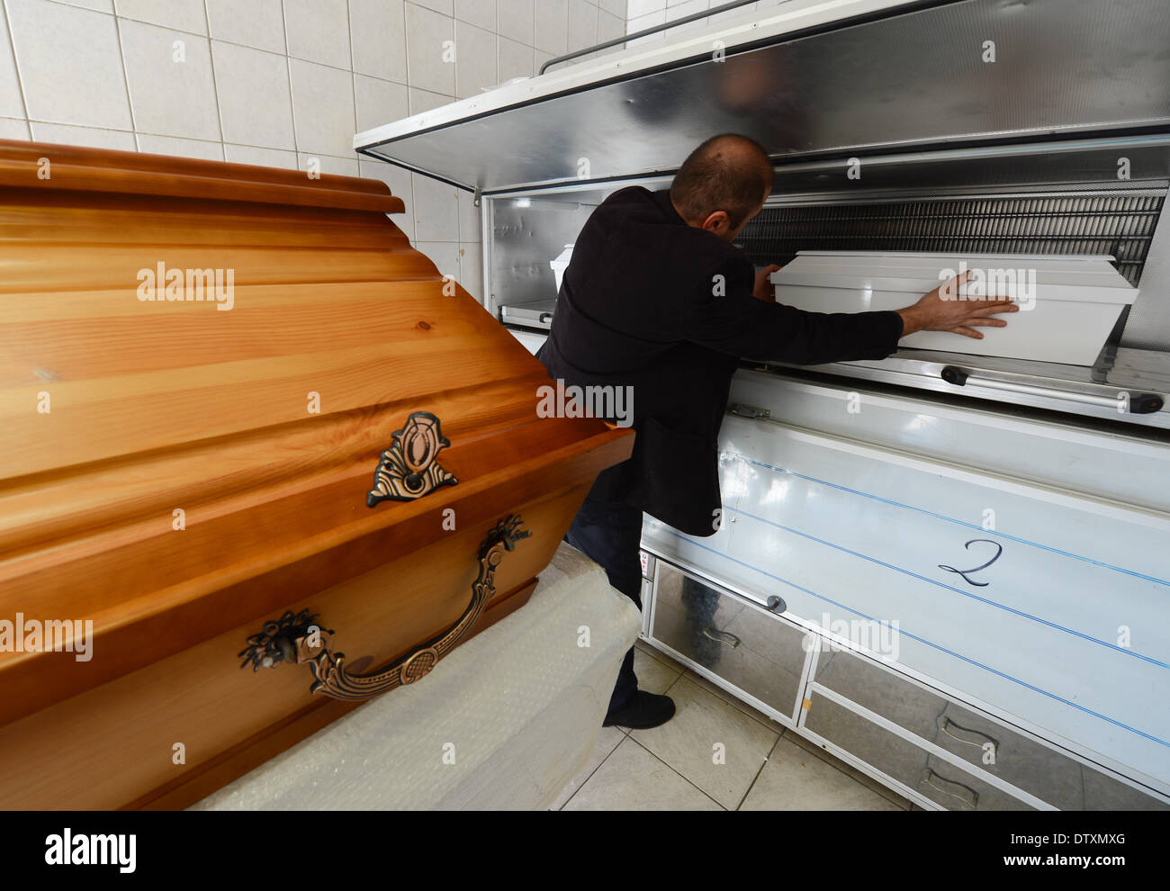 Frankfurt Main, Germany. 24th Feb, 2014. Ali Akilli puts a children's ...
