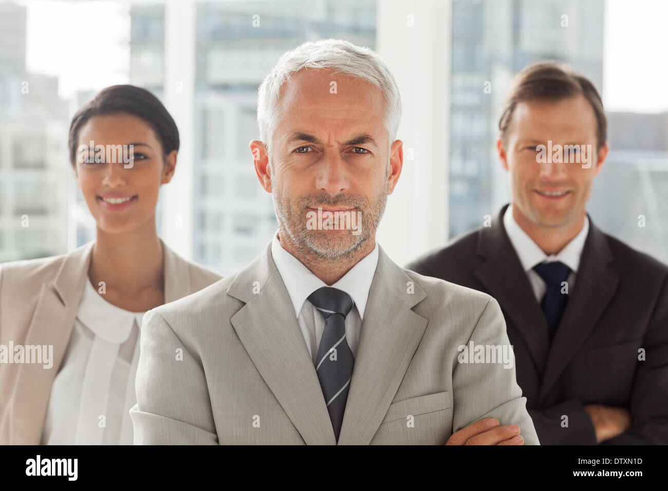 Businessman standing colleagues behind hi-res stock photography and ...