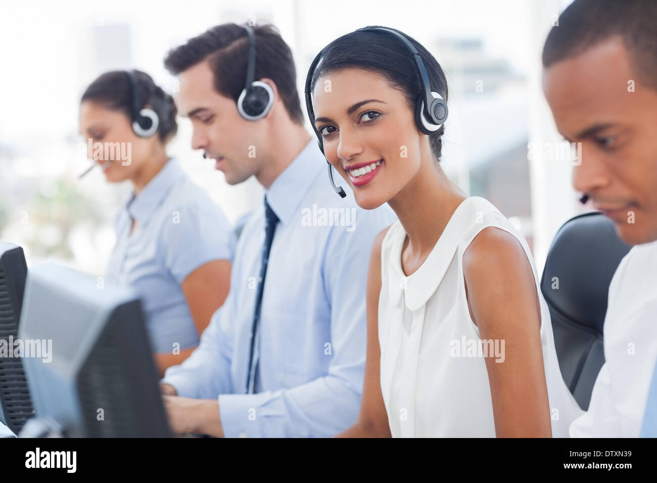 Call centre agent smiling camera hi-res stock photography and images ...