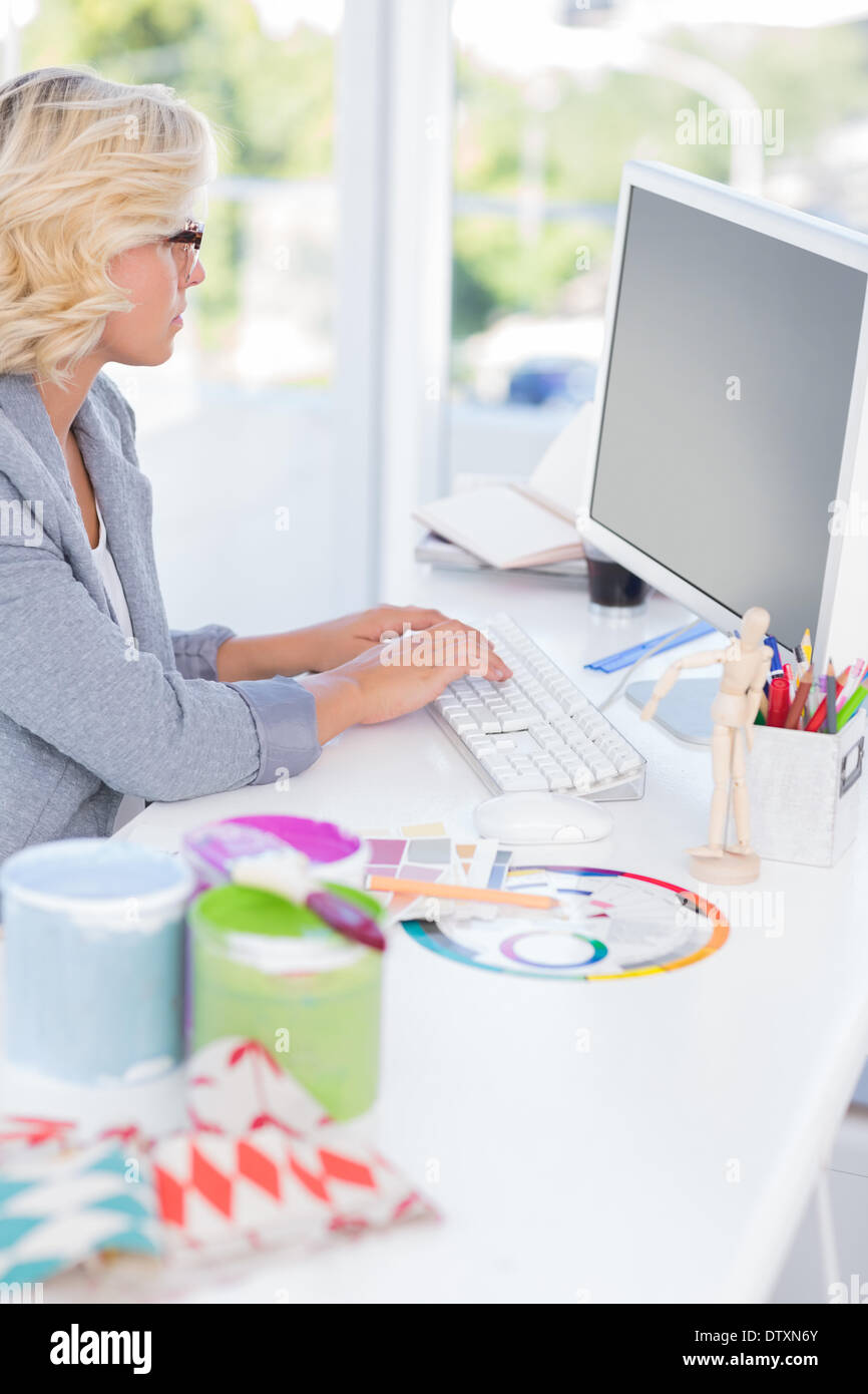 Interior designer working on her computer Stock Photo - Alamy