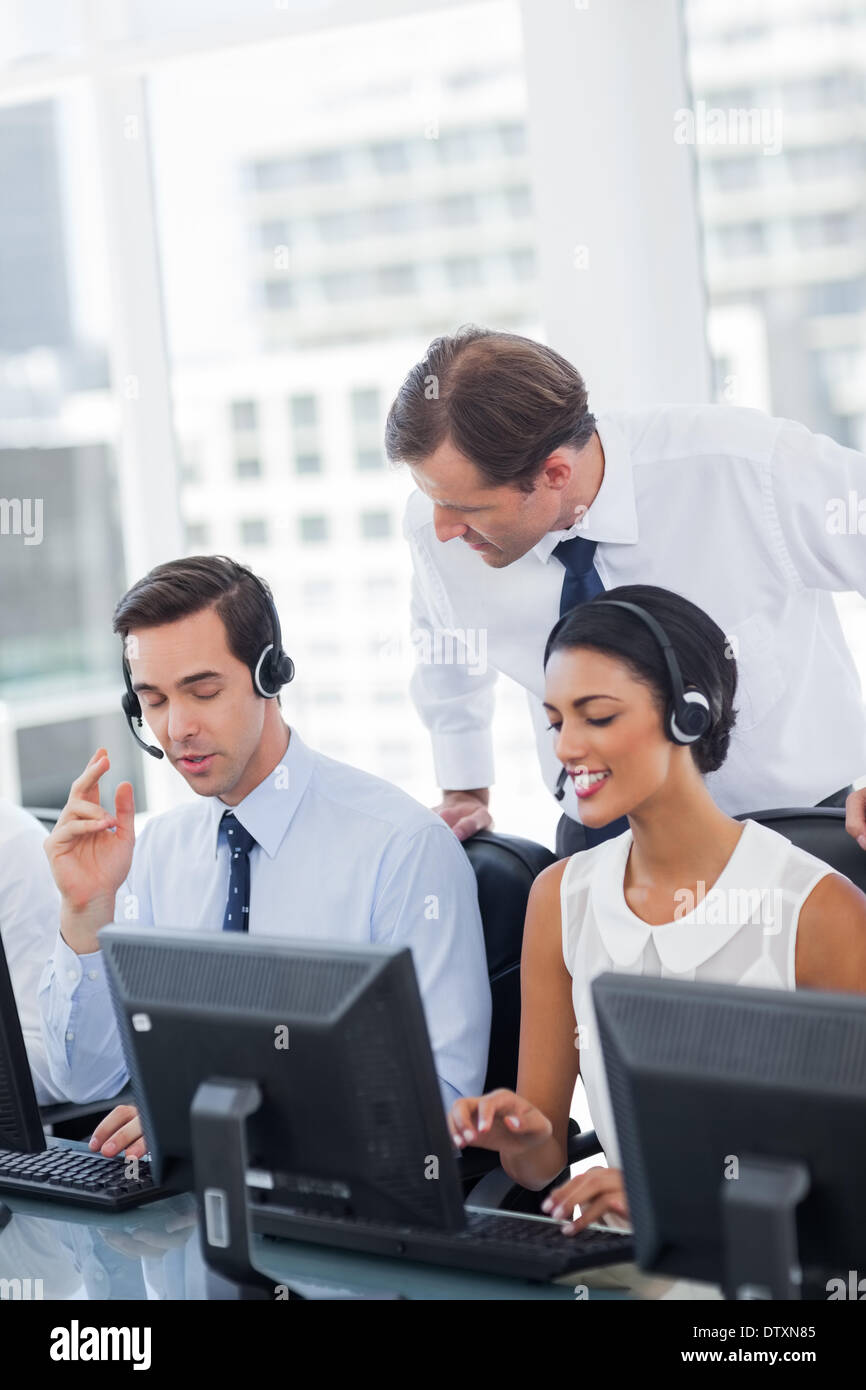 Manager watching employees hi-res stock photography and images - Alamy