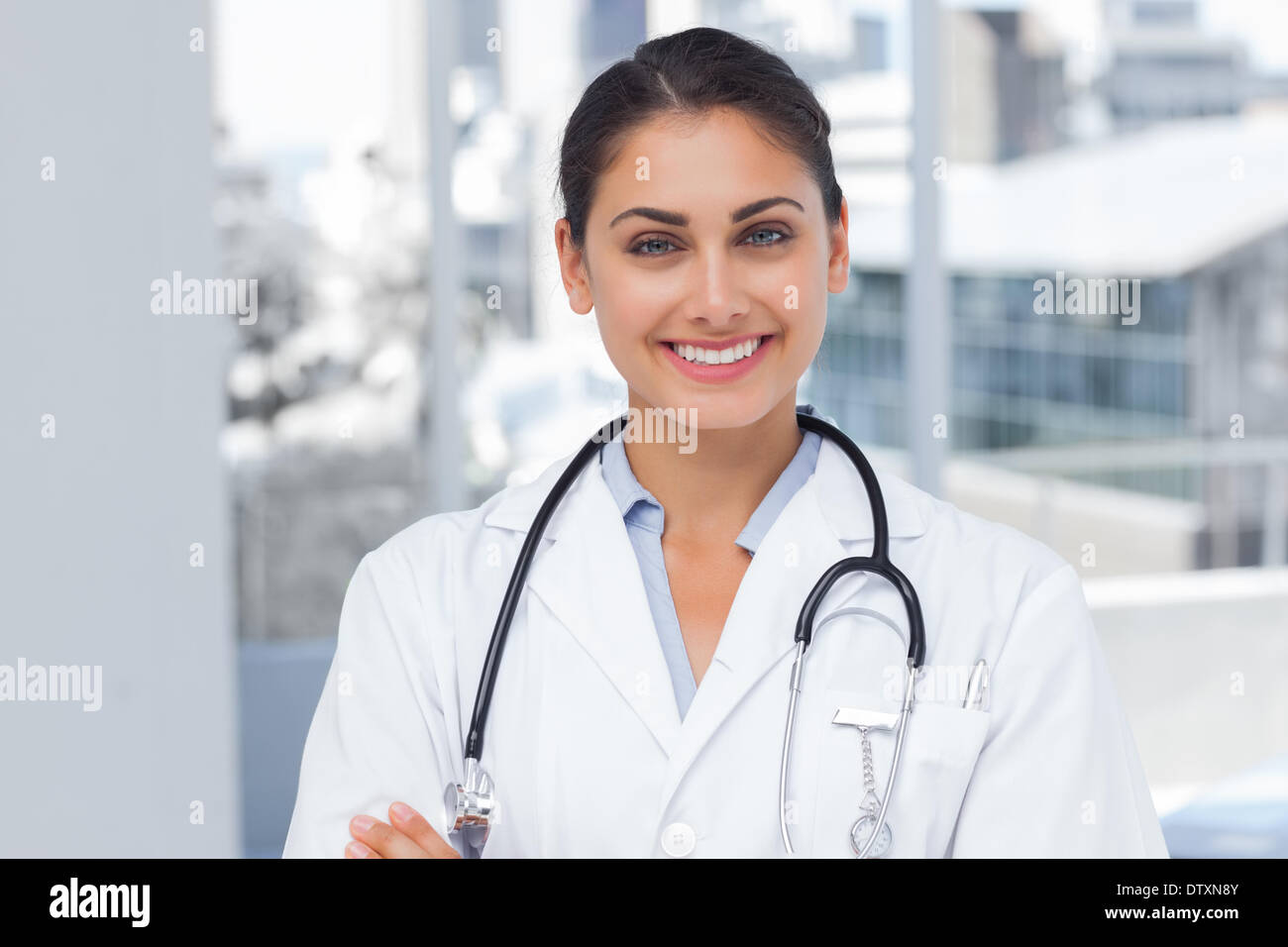 Smiling doctor standing Stock Photo - Alamy
