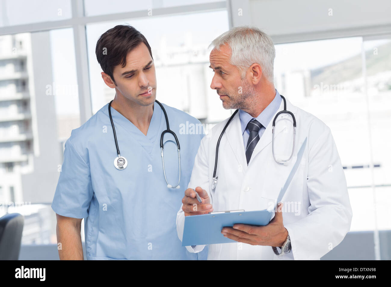 Confident serious caucasian doctor talking hi-res stock photography and ...