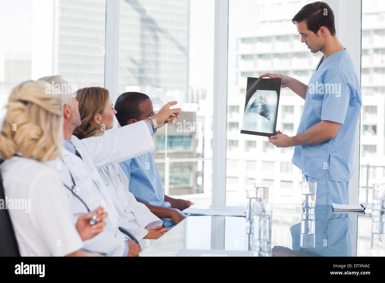 Doctor presenting a radiography Stock Photo - Alamy