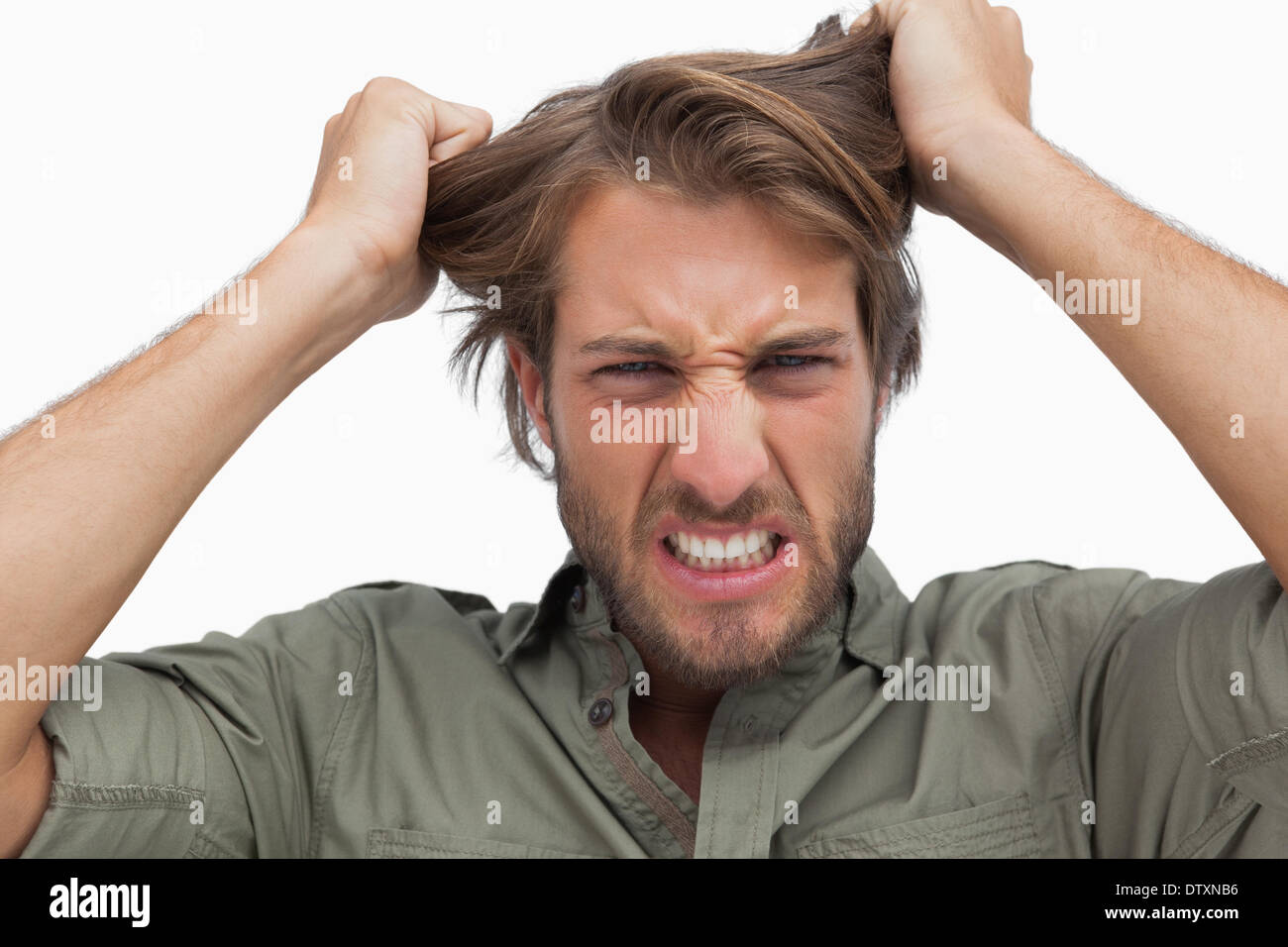 Furious man pulling his hair Stock Photo - Alamy