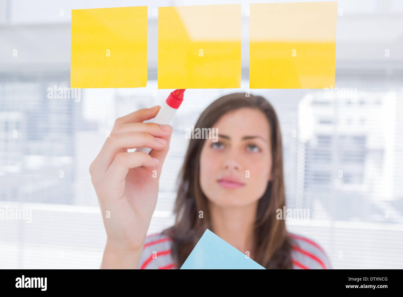 Woman writing on sticky hi-res stock photography and images - Alamy