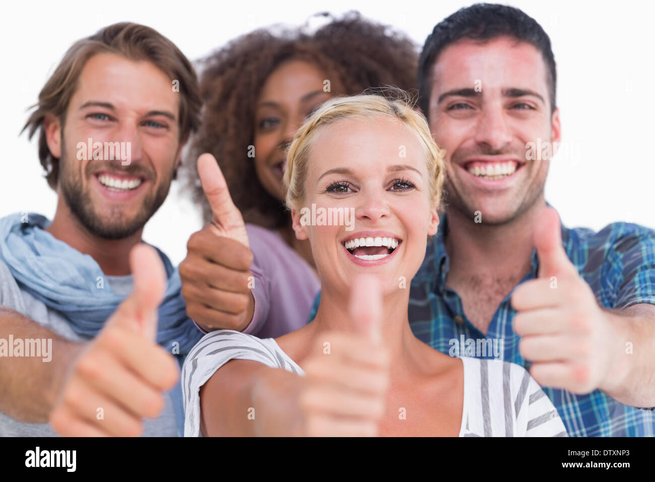 Happy group giving thumbs up Stock Photo - Alamy