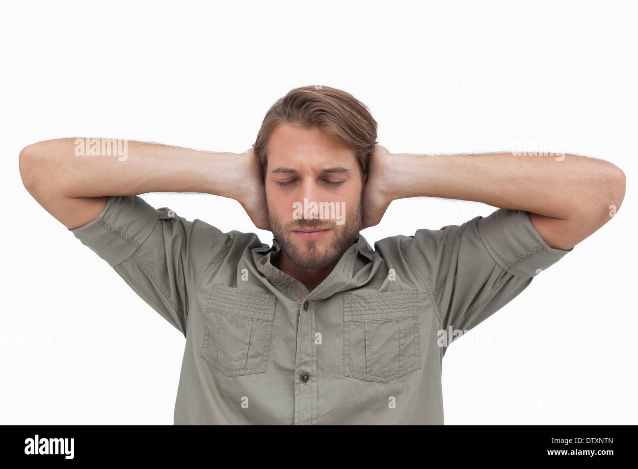 Man blocking his ears and closing his eyes Stock Photo - Alamy