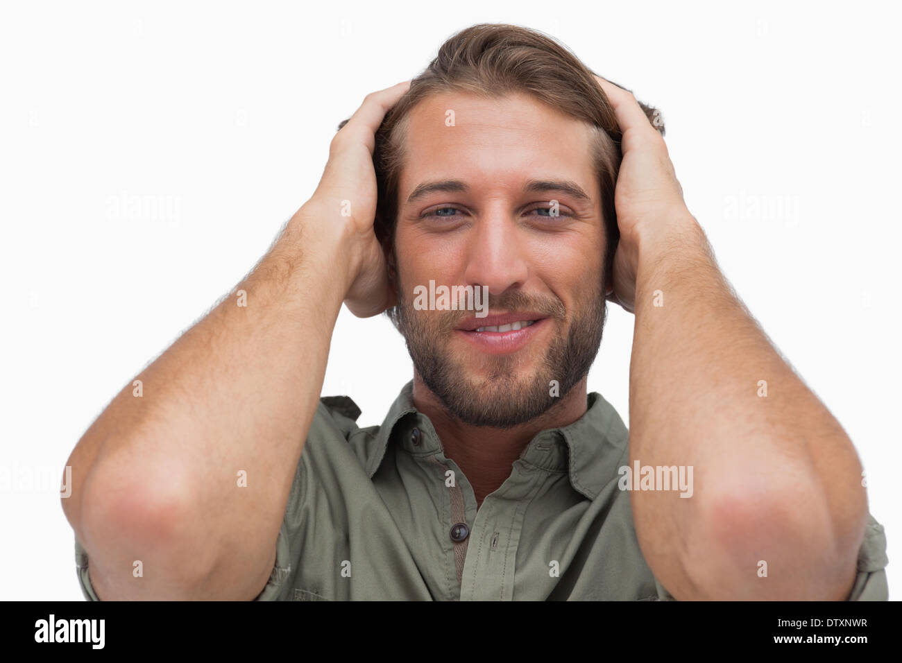 Happy man with hands on head Stock Photo - Alamy