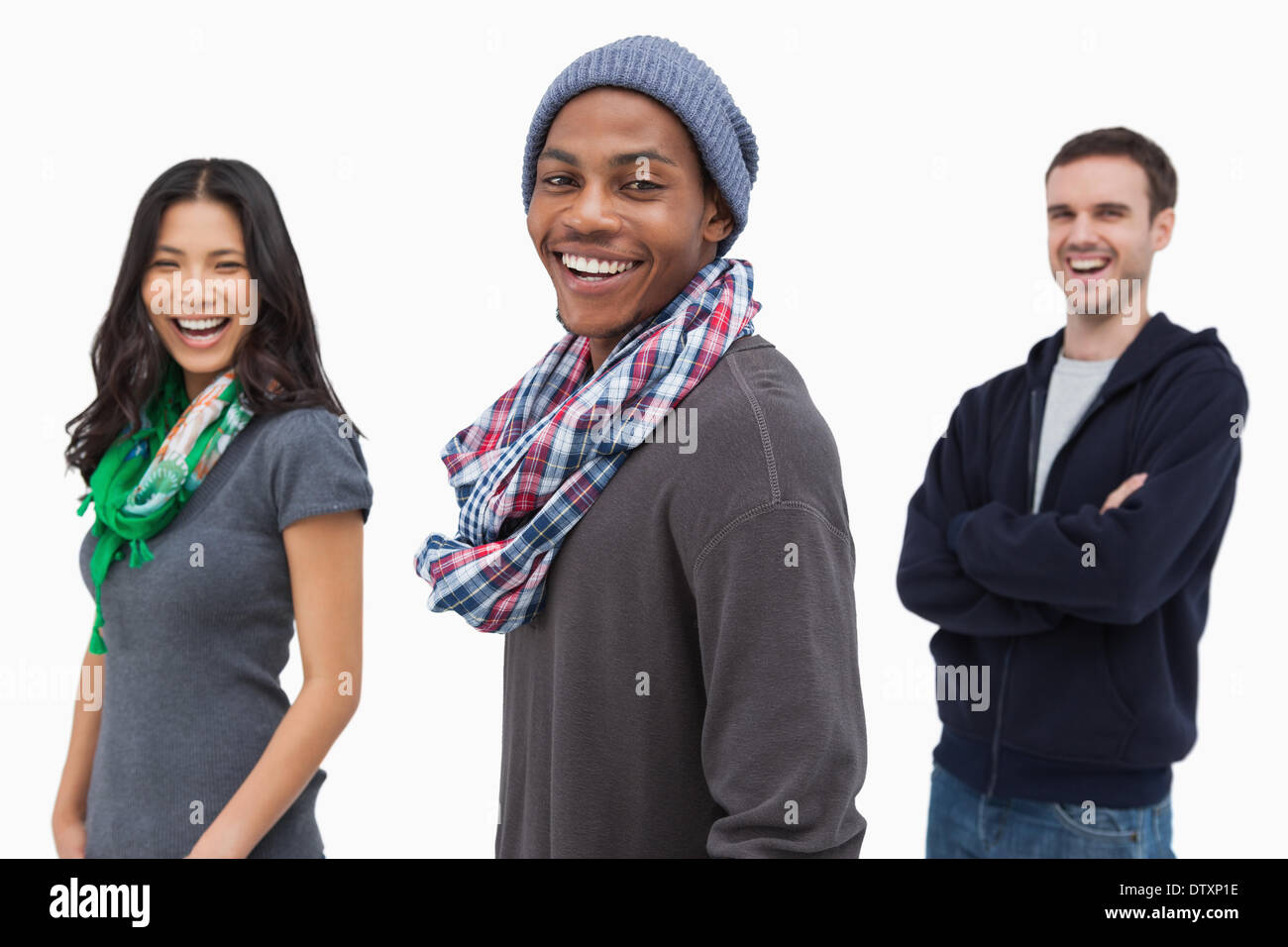 Laughing stylish young people in a row Stock Photo - Alamy