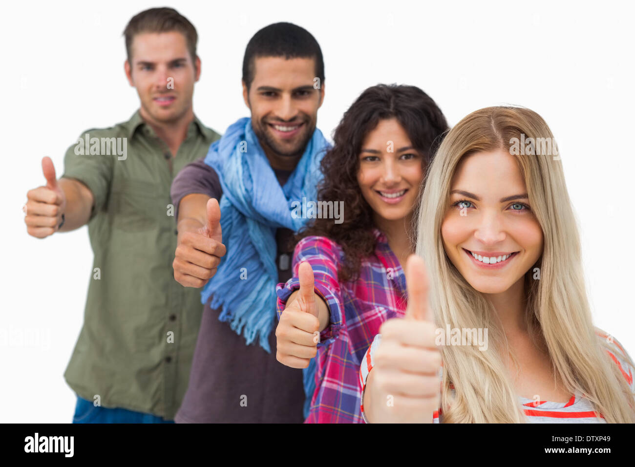 Friends giving thumbs up in a row Stock Photo - Alamy