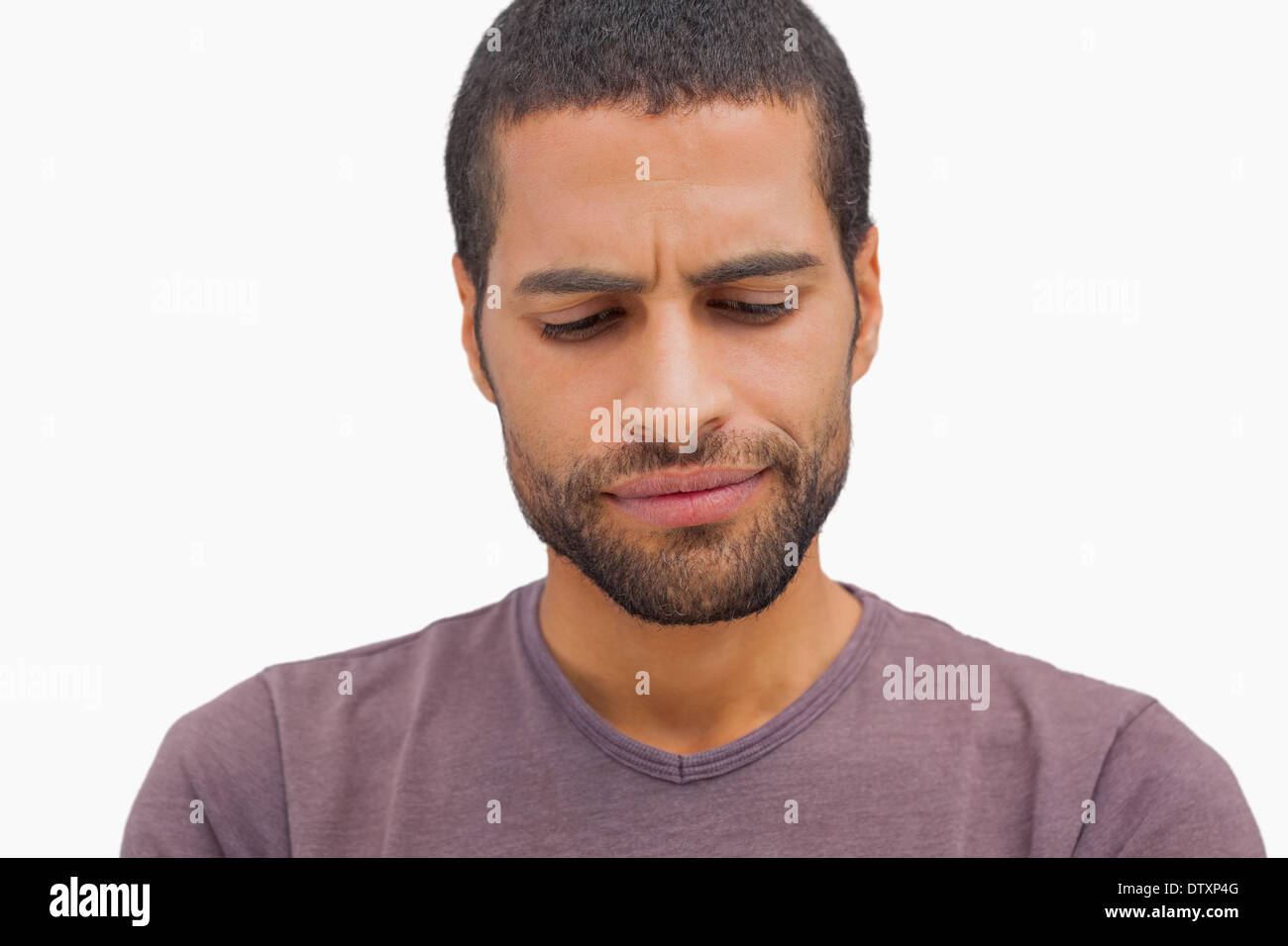Man frowning looking down hi-res stock photography and images - Alamy