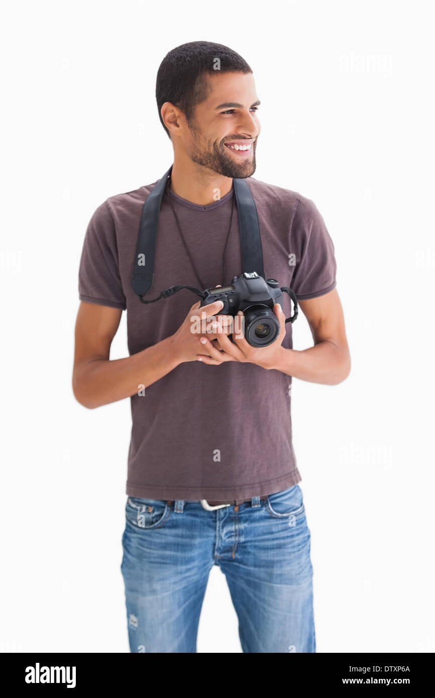 Smiling man with camera around his neck Stock Photo - Alamy
