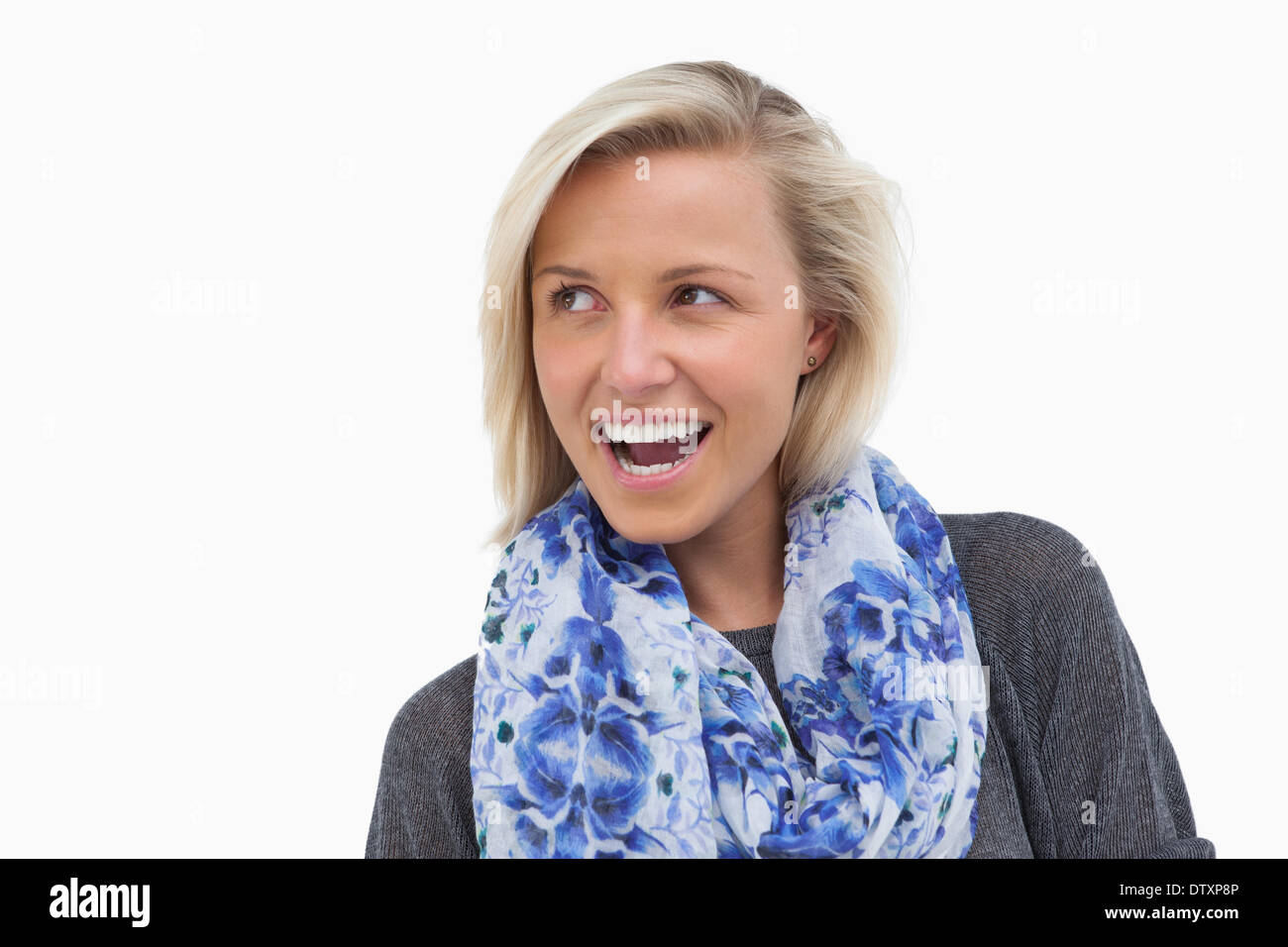 Smiling blonde looking away Stock Photo - Alamy