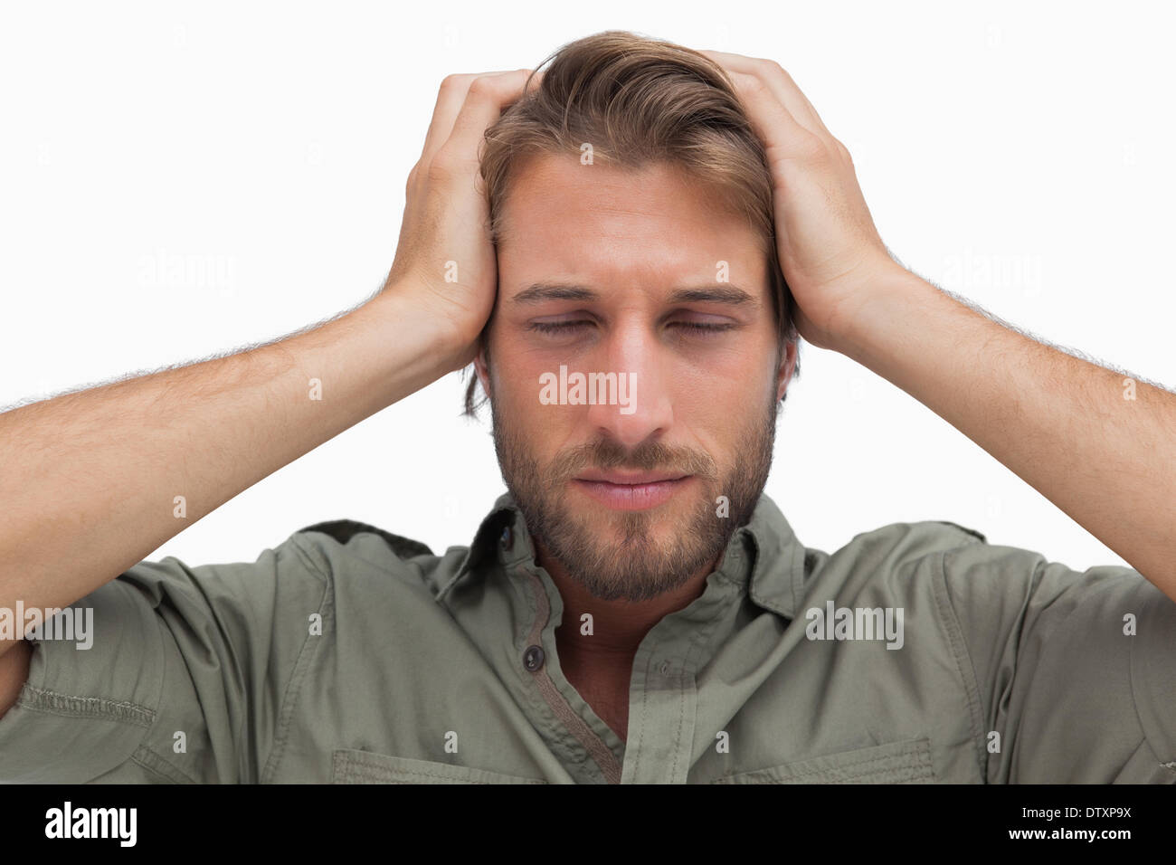 Exhausted man with hands on head Stock Photo - Alamy